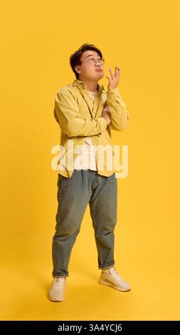 Photo of young man curious thoughtful wonder arm touch chin look empty ...