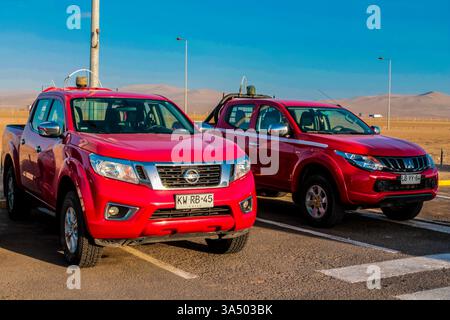 Red off road cars vehicle in Atacama desert in Chile. Long and hard ...