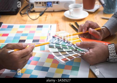 Interior designer chooses a color chart for home design. Graphic ...