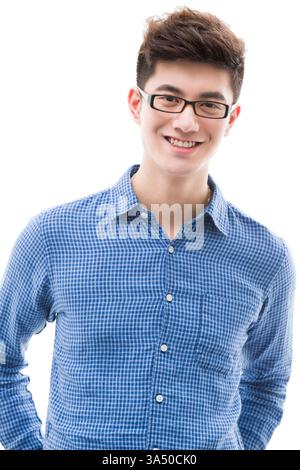 Young chinese man wearing glasses and striped t-shirt standing over ...