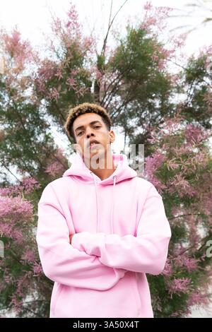 young african american man with dyed hair playing acoustic guitar in ...