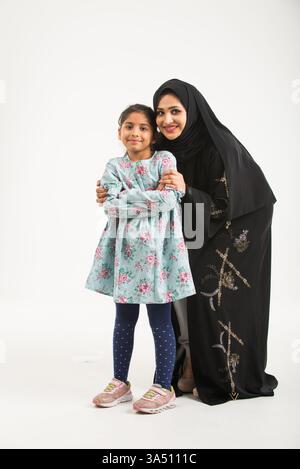 Middle east mother and daughter wearing casual clothes angry and mad ...