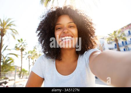Self-portrait of attractive cheerful girl showing ok-sign advert ad ...