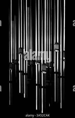 Close-up of a pipe organ with detailed wooden carvings and golden ...