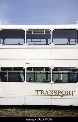 The side view of the lower rows of seats on an old double-decker bus ...
