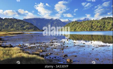 A wonderful summer day in the shallow river. Stony shallows. Chilean ...