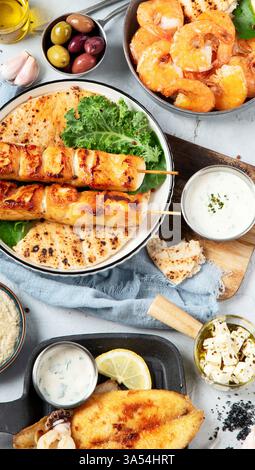 Greek salad on a light blue background Stock Photo - Alamy
