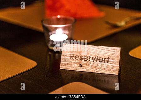German Reserved sign label on the table of restaurant in an Germany ...