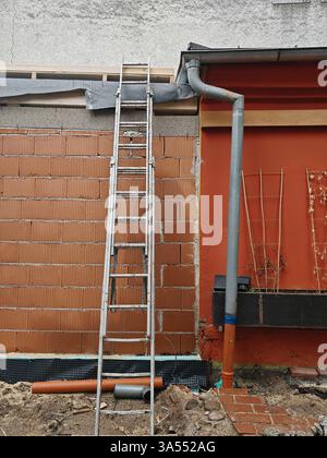 construction worker at topping out or roofing ceremony, when finishing ...