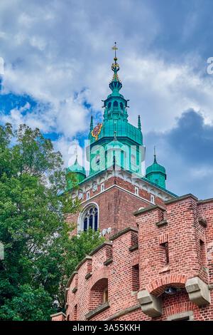 bell and clock tower and spires at the Wawel Cathedral in the city of ...