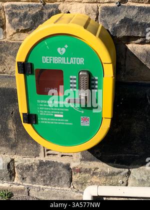 Yellow and green defibrillator machine outside a building in Boston ...
