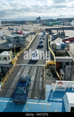 Vehicles drive onto a Brittany Ferries roll on roll off ferry at ...