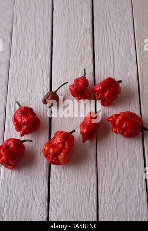 Green bell peppers on straw background Stock Photo - Alamy
