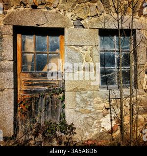 Abandoned stone building with doors and windows Stock Photo - Alamy