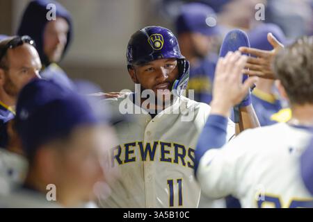 Milwaukee Brewers' Garrett Mitchell (5) scores on an RBI single hit by ...