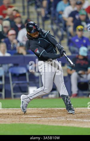 Arizona Diamondbacks' Eugenio Suárez, left, jogs to first base after ...