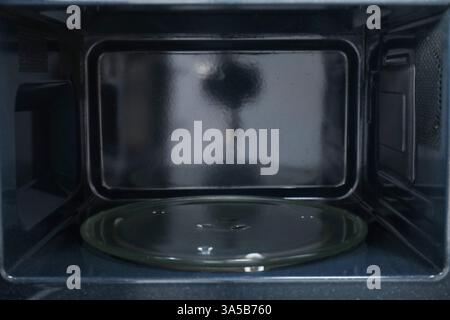 Open empty microwave oven, closeup. Inside view Stock Photo - Alamy