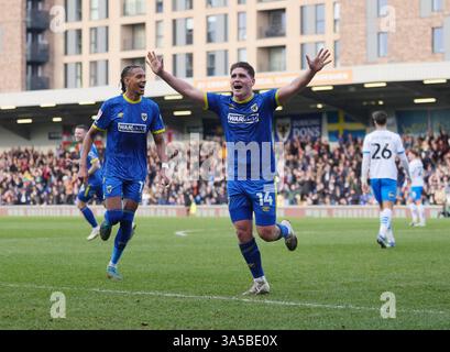 AFC Wimbledon's Matty Stevens celebrates with the trophy following ...