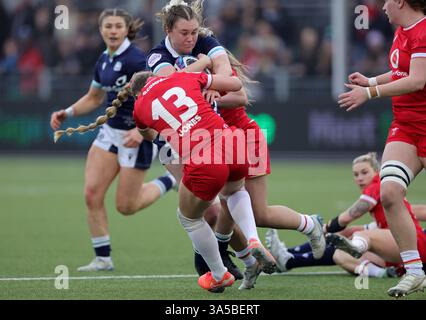 Scotland's Hollie Cunningham is tackled by Wales' Hannah Jones during ...