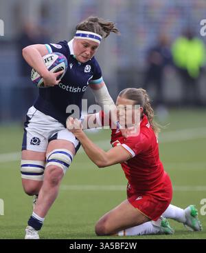 Scotland's Rachel McLachlan is tackled by Wales' Carys Cox during the ...