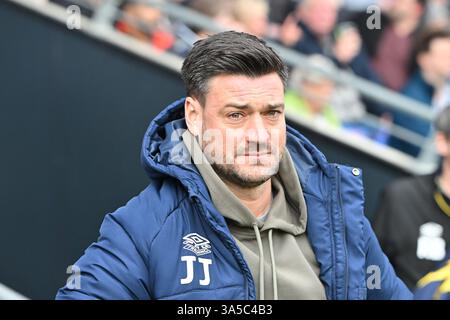 Johnnie Jackson manager of AFC Wimbledon watches on during the Sky Bet ...