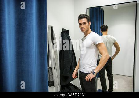 Handsome men changing clothes in locker room Stock Photo - Alamy