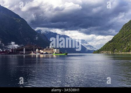 Small town of Odda. Magical late summer sunset illuminates the city and ...
