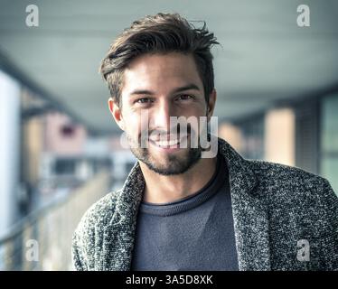 Photo of cheerful young man standing with his pregnant woman isolated ...