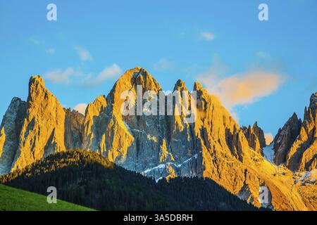 The Dolomites. Magnificent serrated cliffs illuminate the summer sunset ...