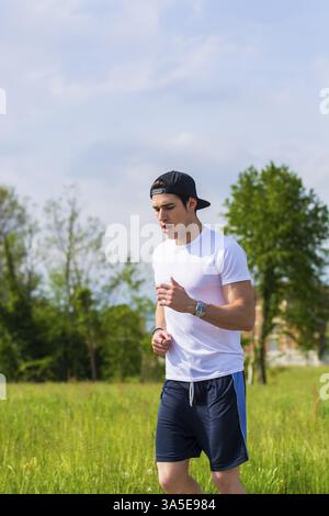 Young handsome sporty man wearing sweatshirt over isolated background ...