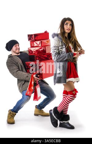 Handsome man with Christmas presents on blue background Stock Photo - Alamy