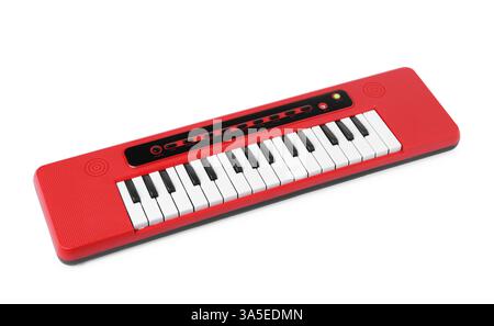 Red toy electric piano isolated on white. Child's musical instrument ...