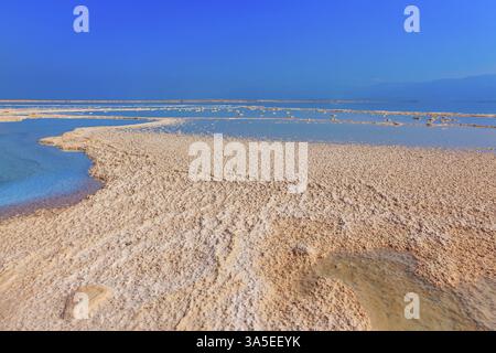 The evaporated salt acts over a water surface beautiful patterns ...
