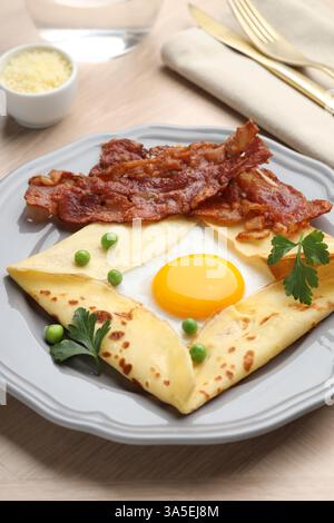 Breton crepe with cheese and bacon on the wooden background Stock Photo ...