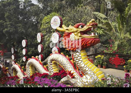 Traditionally decorated ladder in the Chinese park - a red dragon and ...