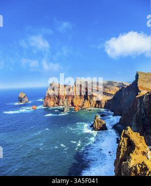 The blinding midday sun illuminates the rocky shore. The boiling ...