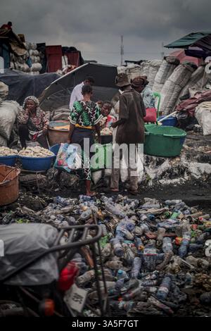 Market in Kinshasa, stalls surrounded by plastic waste, environmental ...