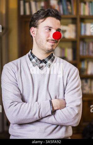 Photo of good looking glad man wear stylish clothes presenting novelty ...