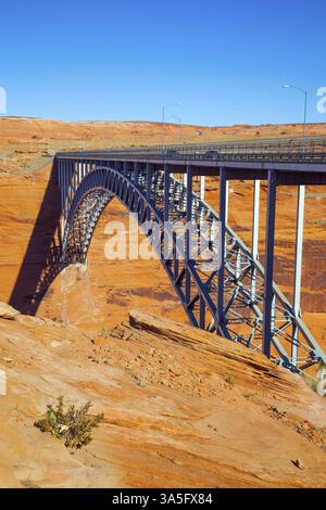 Picturesque red sandstone is the base of the bridge. Arched bridge from ...