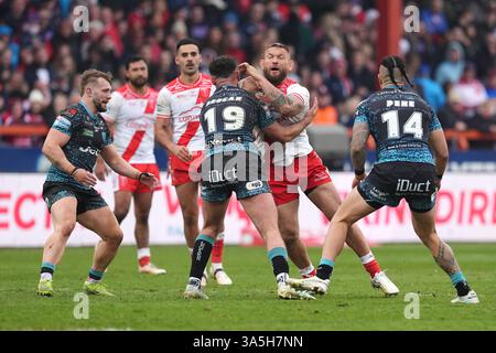 Hull KR's Jared Waerea-Hargreaves is tackled by Hull FC's Zak Hardaker ...