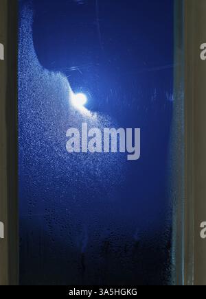 Moonlight through the window. Sweaty glass Stock Photo - Alamy