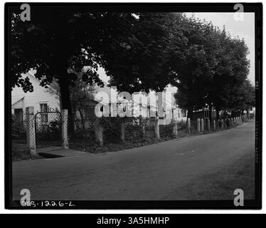 A typical surfaced street with houses in the company housing project at ...