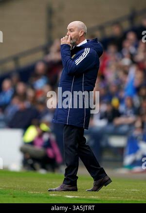 Scotland manager Steve Clark (second right) looks on during a training ...