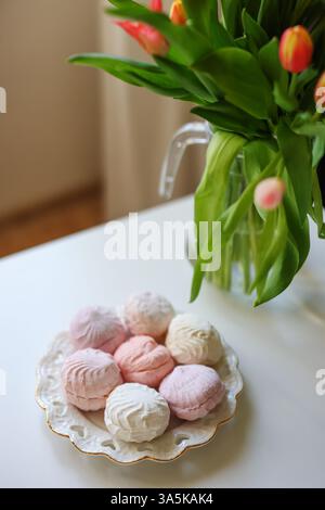 Zephyr tulips. Natural homemade marshmallow. Arranged on a tray. Close ...