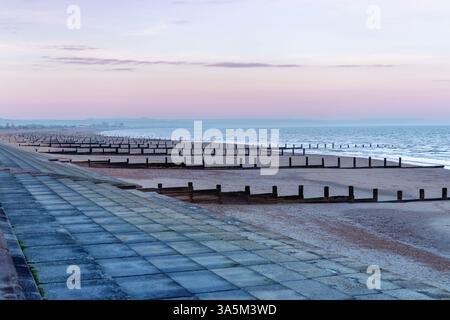 Anti-flooding groynes at Dymchurch Sae Wall along the beach in Romney ...