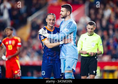 Spain goalkeeper Unai Simón (23) collides with his teammate during the ...