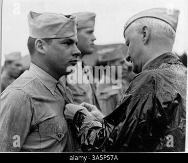 Admiral Chester W. Nimitz awarded the Silver Star to Coast Guardsman Daniel J. Tarr aboard a ...