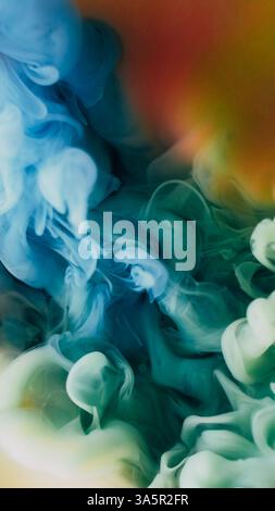 Ink steam. Underwater mist. Blur blue purple pink color liquid splash ...