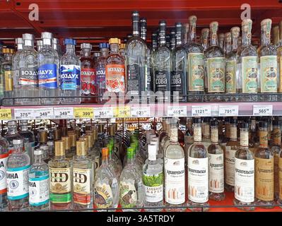 A selection of bottles of top shelf liquor displayed in the window of a ...