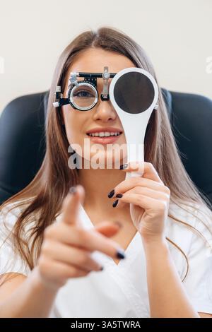 Ophthalmologist is checking up patient in eye doctor hospital Stock ...